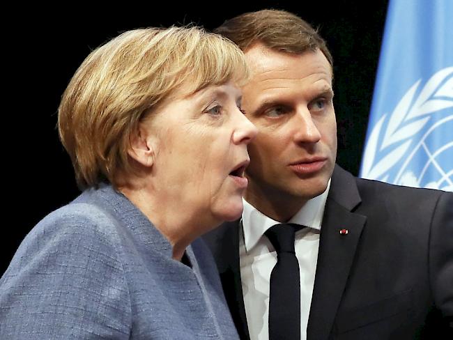Bundeskanzlerin Angela Merkel und Frankreichs Präsident Emanuel Macron ...